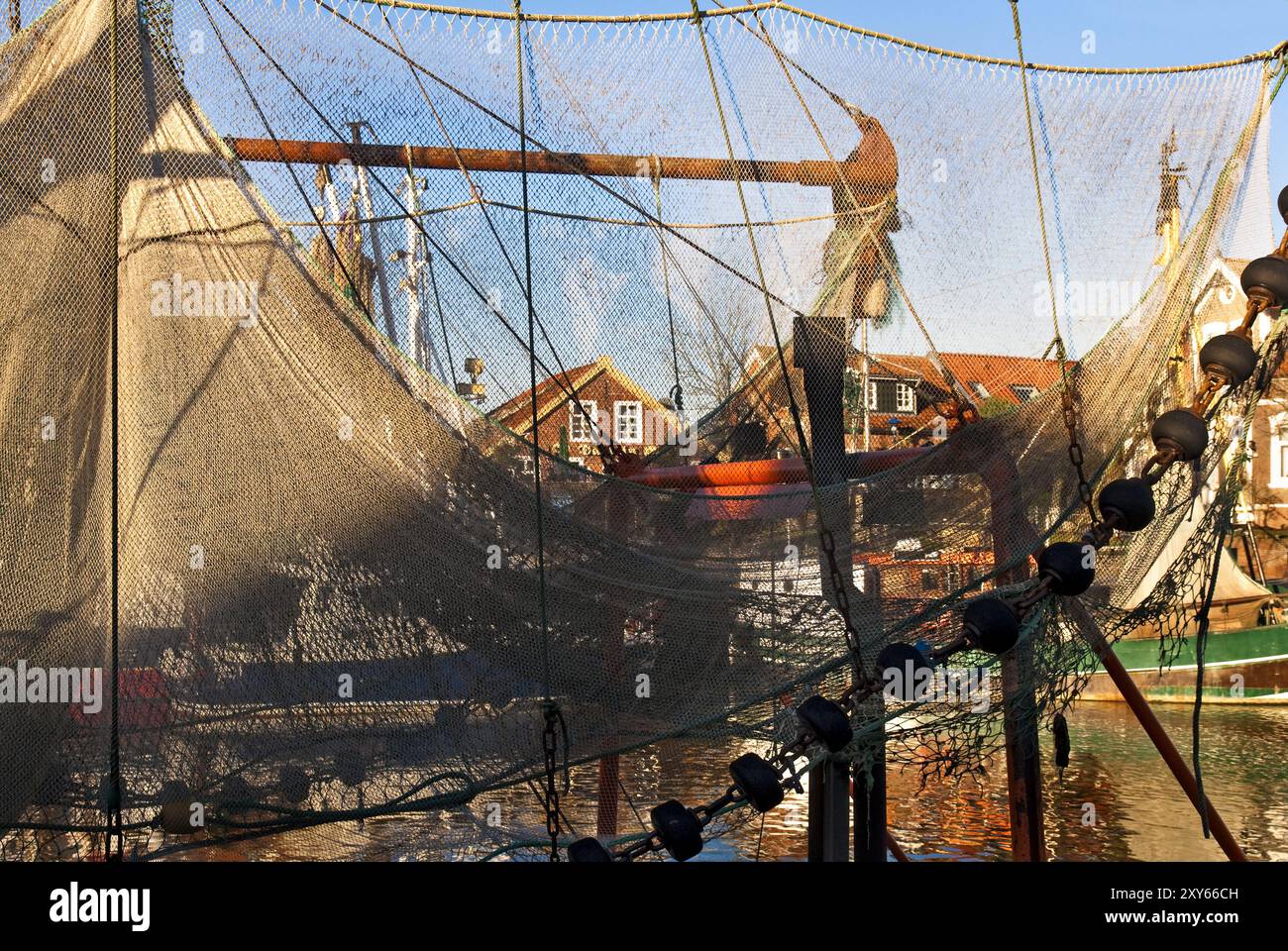 Stretched fishing nets in Neuharlingersiel harbour Stock Photo - Alamy
