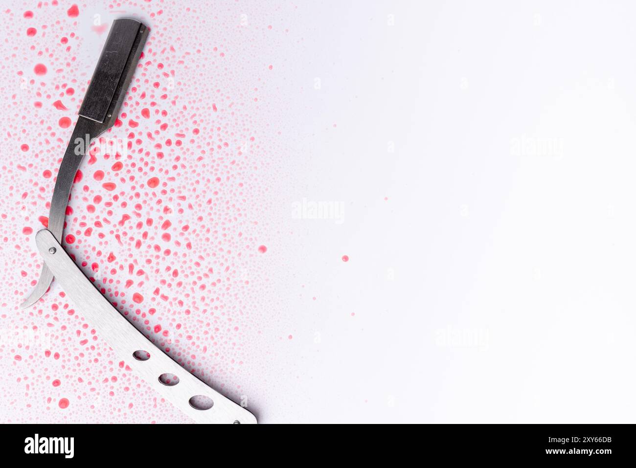 A top-down view of a blood-stained barber's razor, detailed and vivid ...