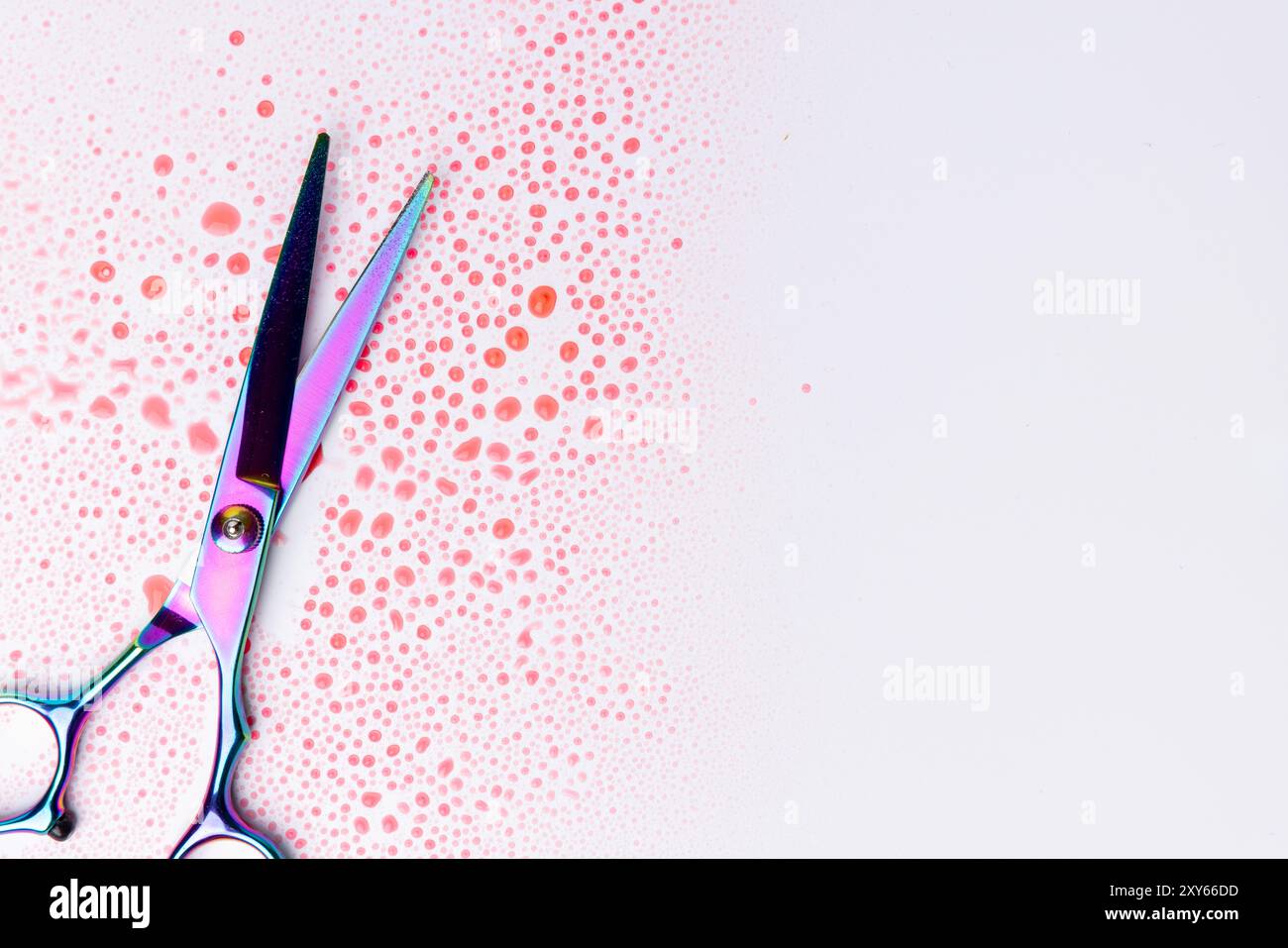 A top-down view of scissors covered in blood, positioned on a white ...