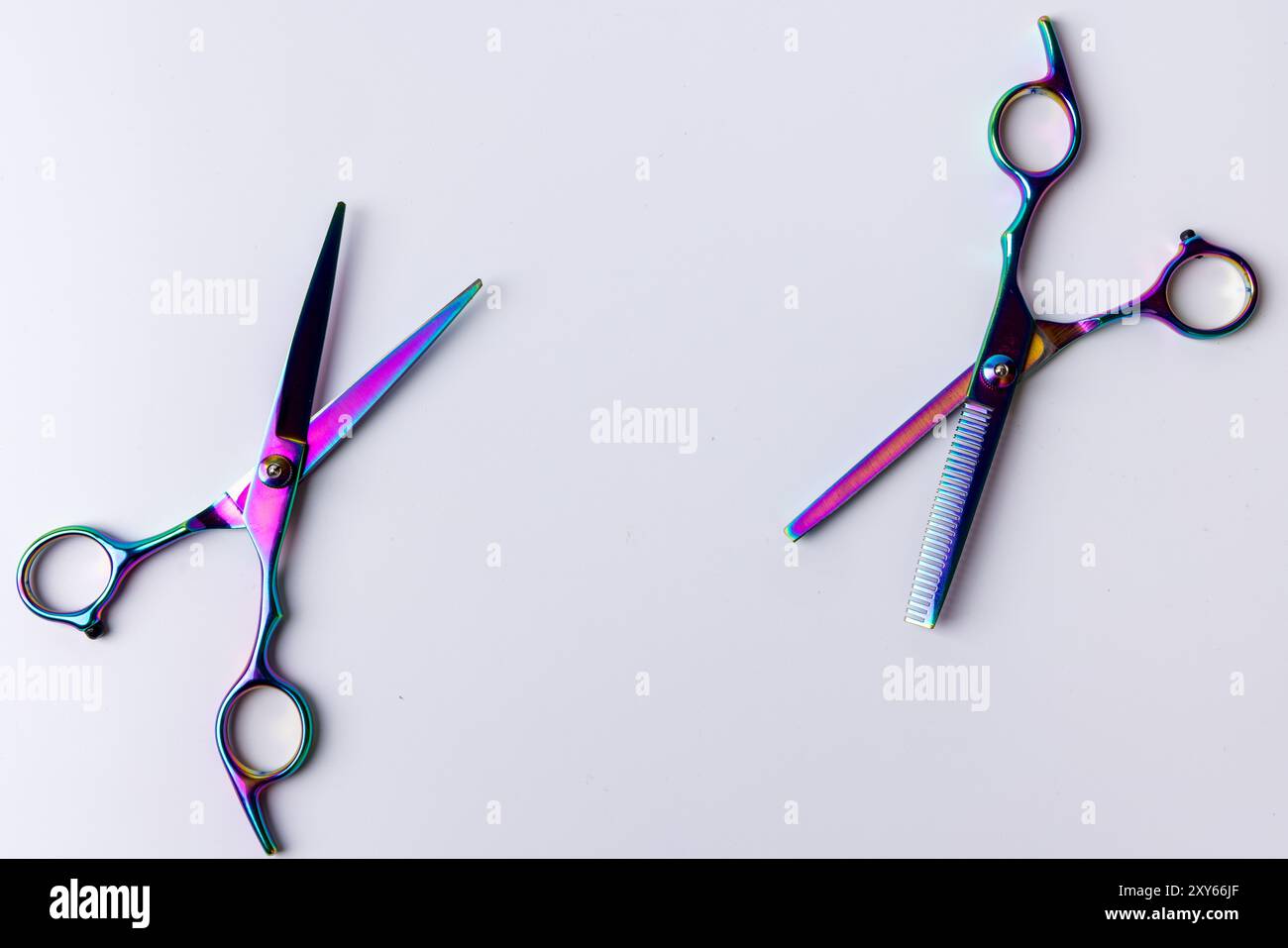 A top-down view of two open scissors positioned on the left and right ...