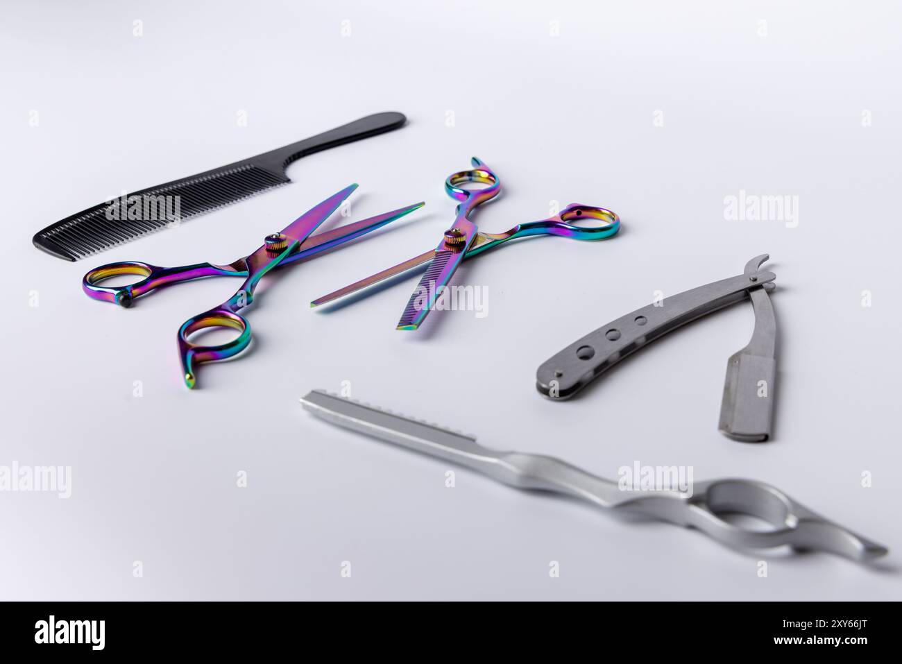 A top-down view of essential barber tools including scissors, clippers ...