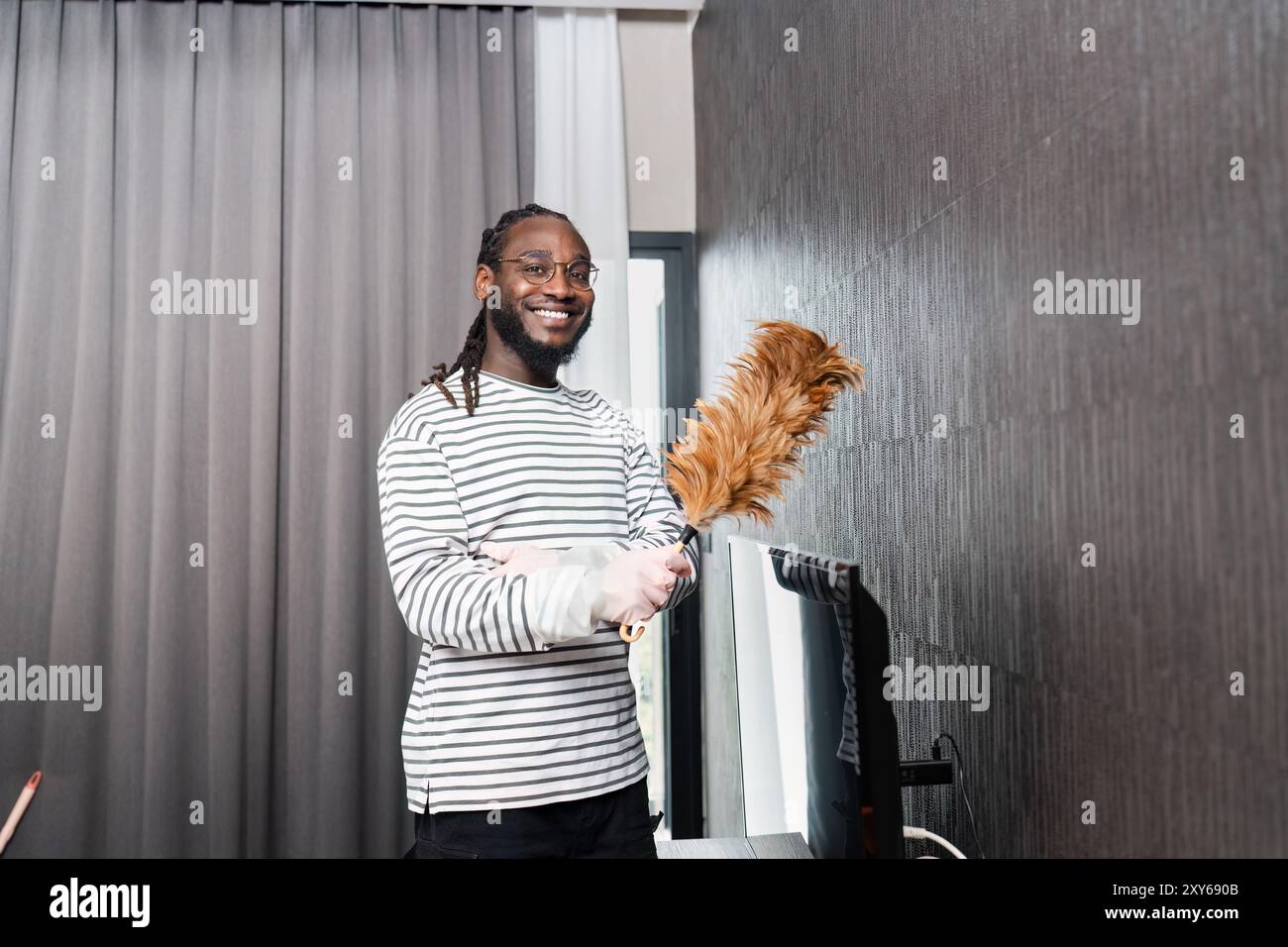 Man with feather duster hi-res stock photography and images - Alamy