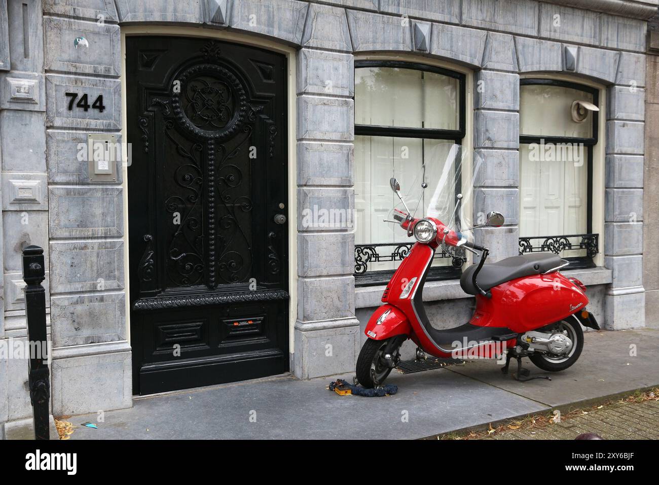 AMSTERDAM, NETHERLANDS - JULY 10, 2017: Red Piaggio Vespa scooter ...