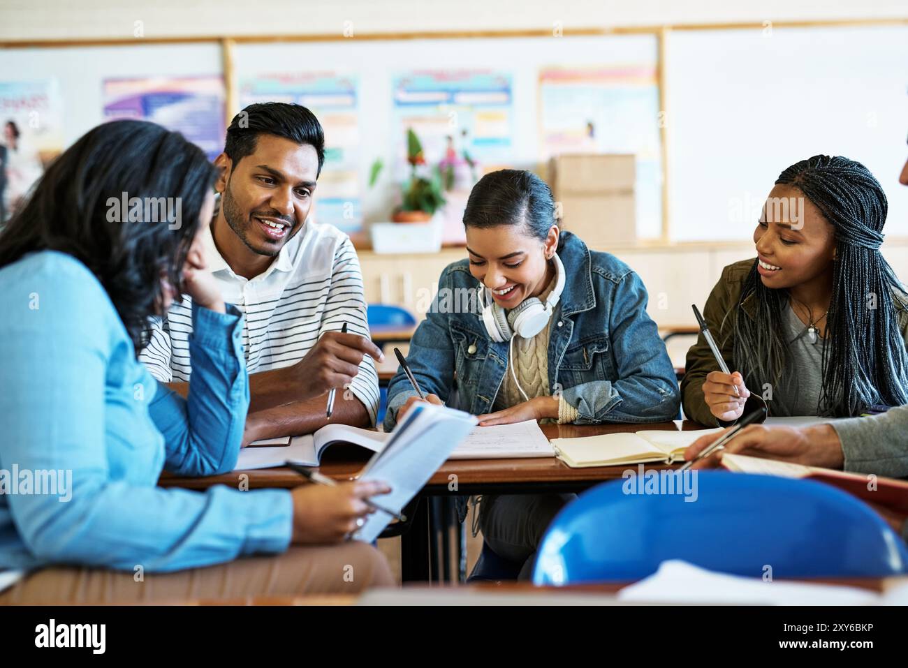 Smile, students and classroom for group assignment with education on ...