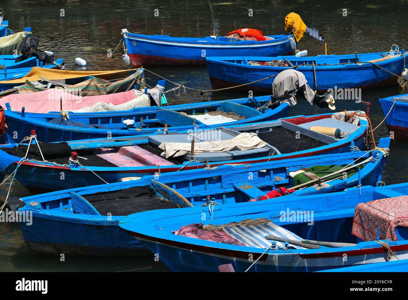 Blue traditional fishing boats in Mediterranean harbor of Bari, Italy ...