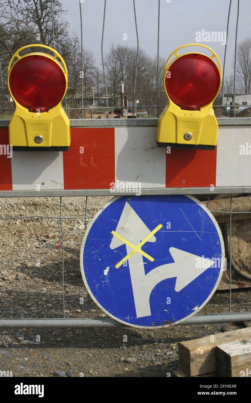Signs and warning lights at a construction site Stock Photo - Alamy