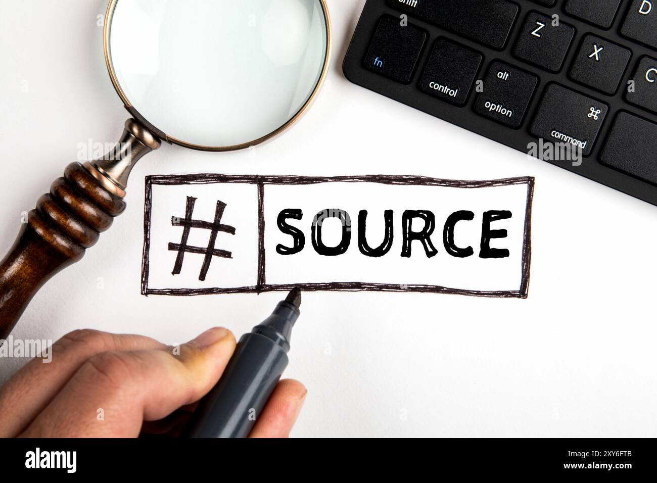 Source. Magnifying glass and computer keyboard on office table Stock ...