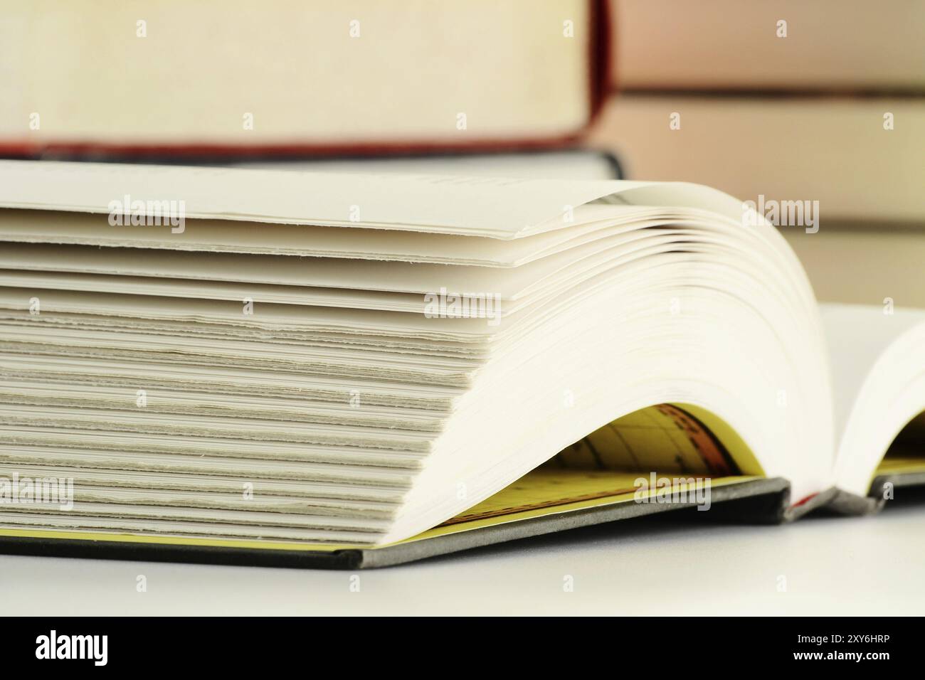 Open book on the table Stock Photo - Alamy