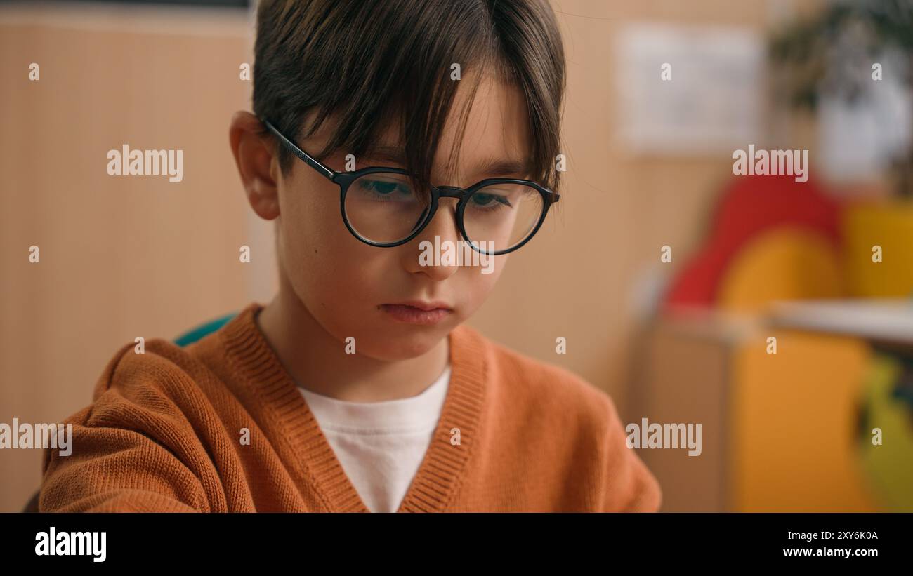 Close up portrait little sad upset frustrated son child kid pupil ...