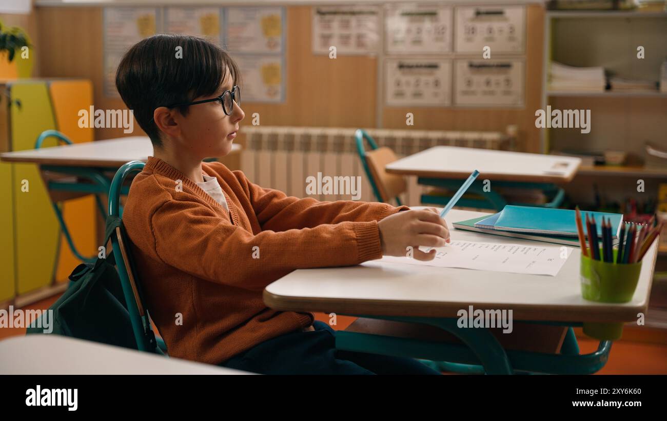 School class lesson clever concentrated Caucasian boy son child ...