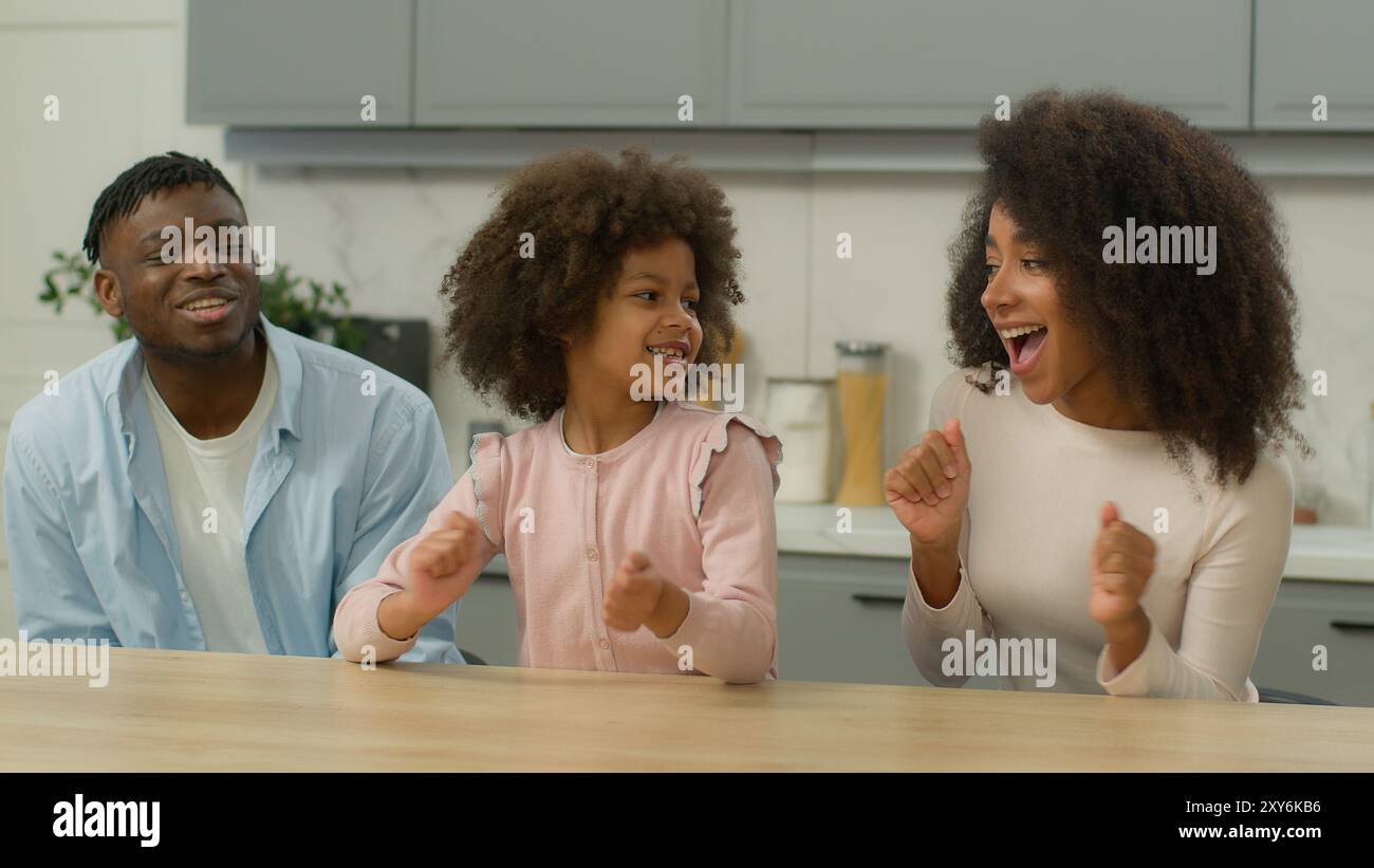 Carefree African American family biracial ethnic happy parents and cute ...