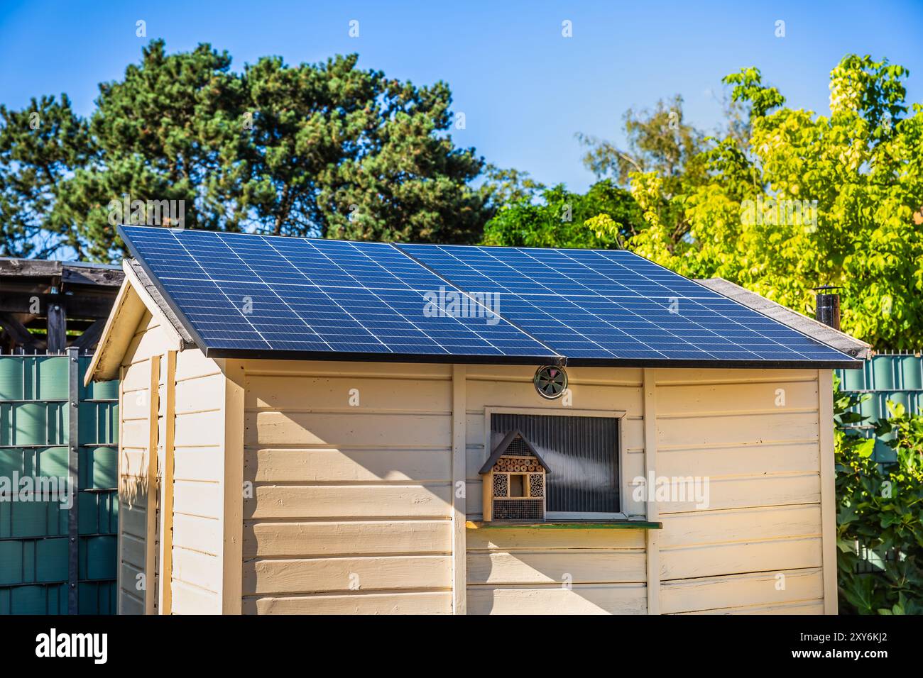 Small solar panels installed on garden shed, backyard shed Stock Photo ...