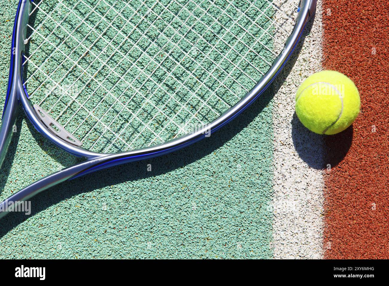 Close up of tennis racquet and ball on the clay tennis court Stock ...