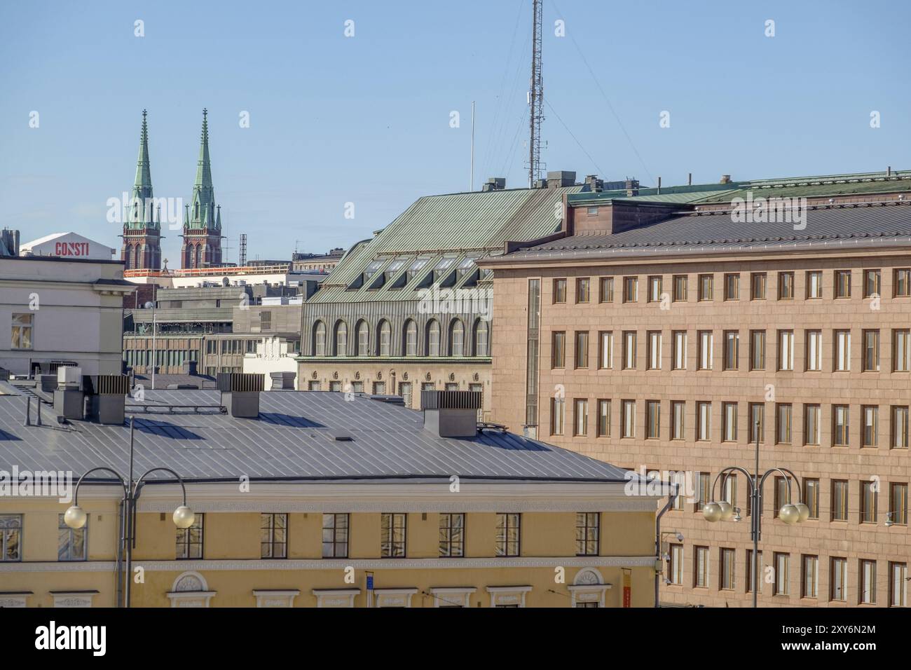 City view with various buildings and roofs under a blue sky, Helsinki ...