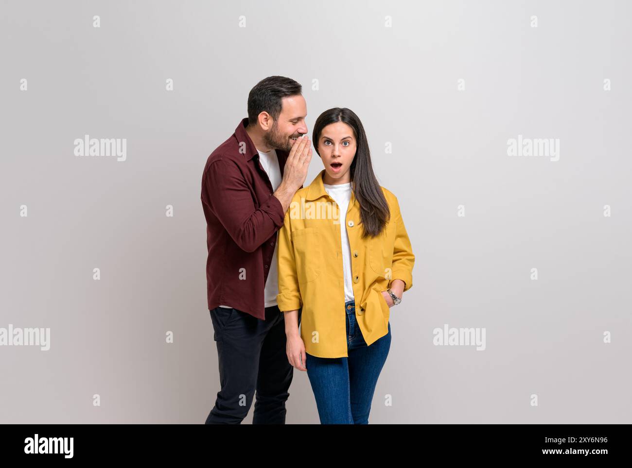 Man whispering in girlfriend ear hi-res stock photography and images ...