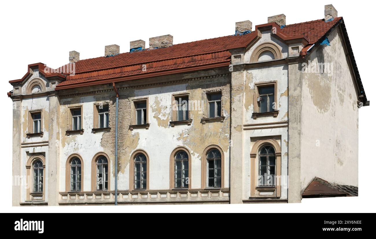 Destroyed old house with dirty windows and bricks stove pipes. Isolated ...