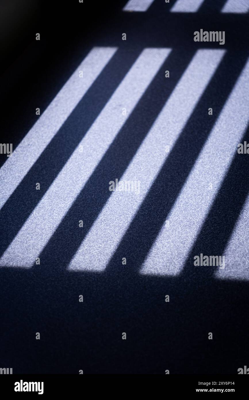 shadow bars on gray surface sun bars light rays Stock Photo - Alamy