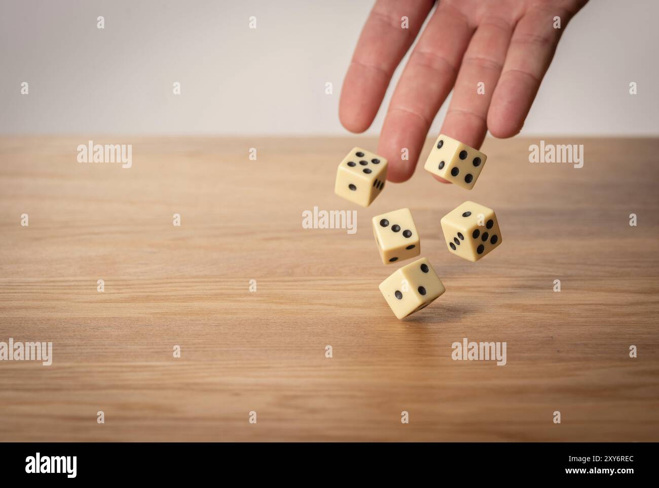 Hand throwing dice hi-res stock photography and images - Alamy