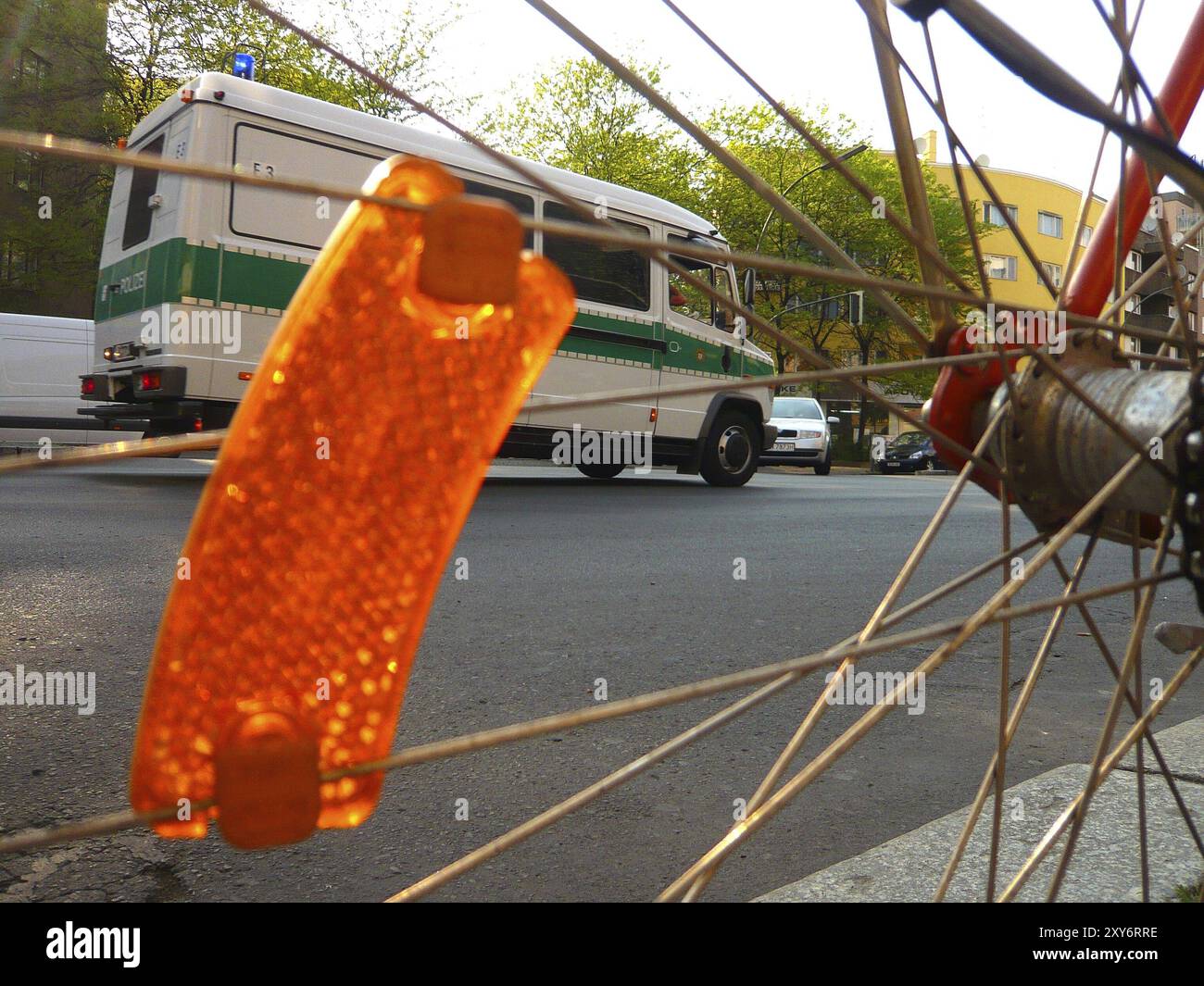 Spoke reflector with passing police car Stock Photo - Alamy