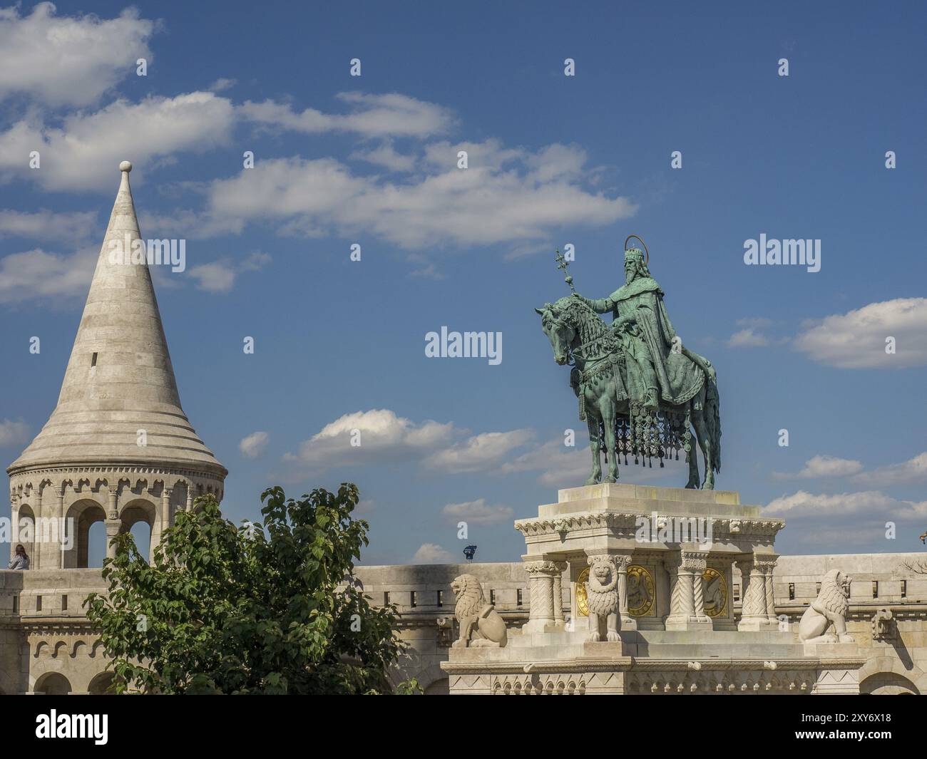 Equestrian statue and historic towers under a clear blue sky with ...