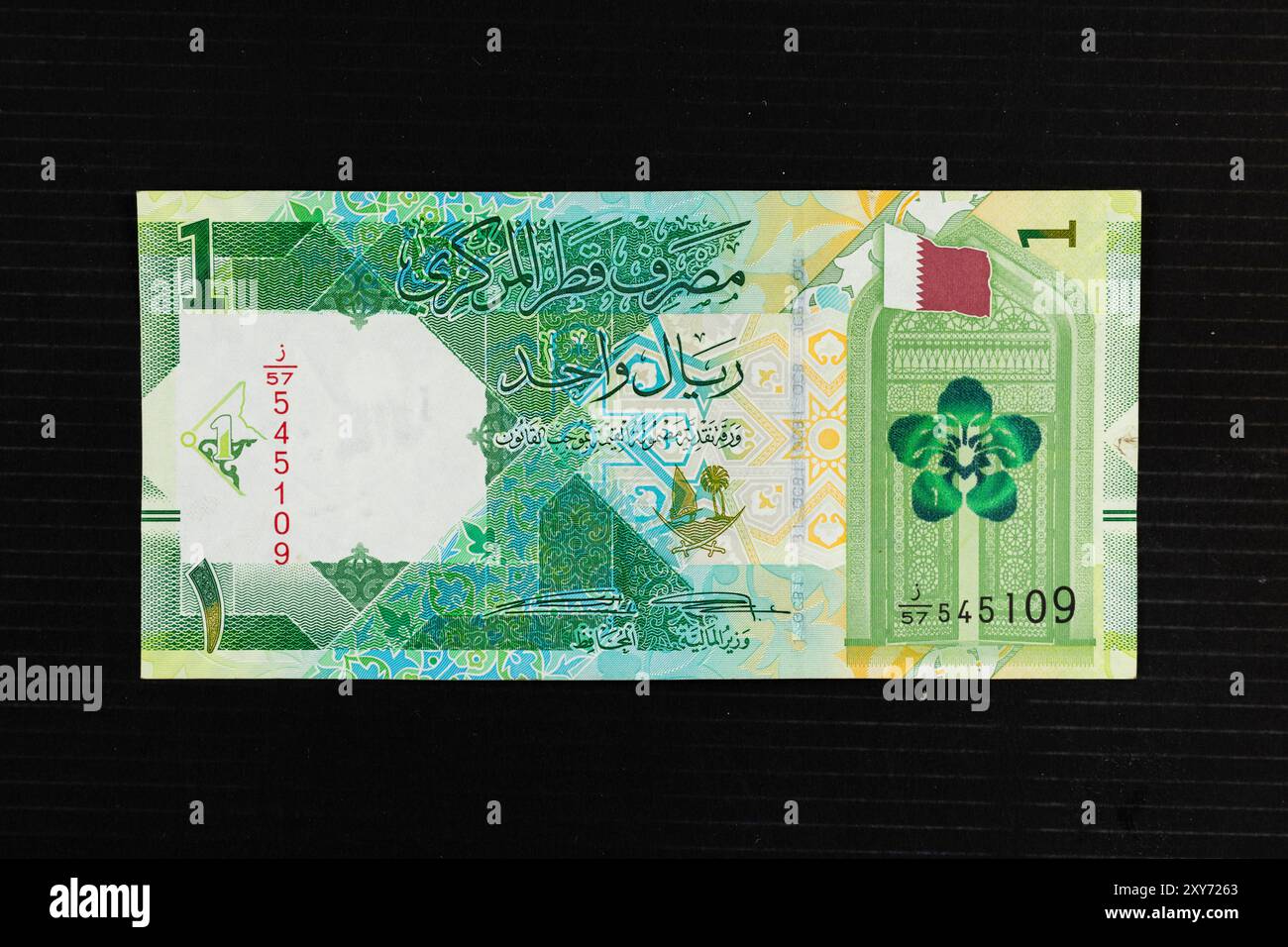 Traditional geometric patterns, flag of Qatar, flower ( Dreama ) and a ...