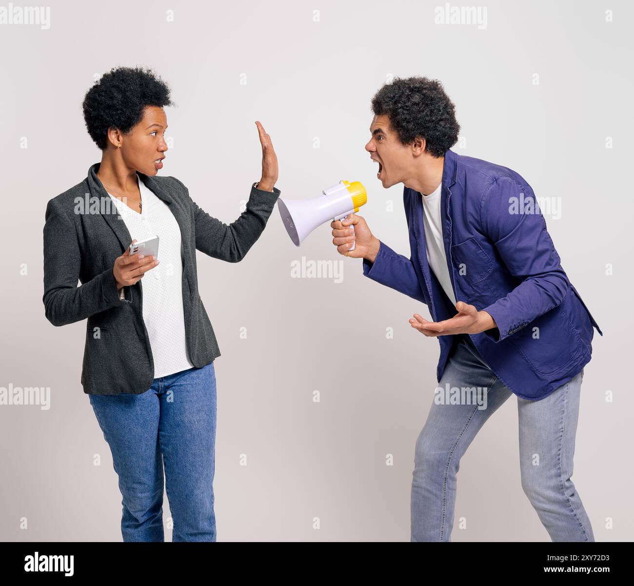 Furious businesswoman showing stop sign to man shouting at her with ...