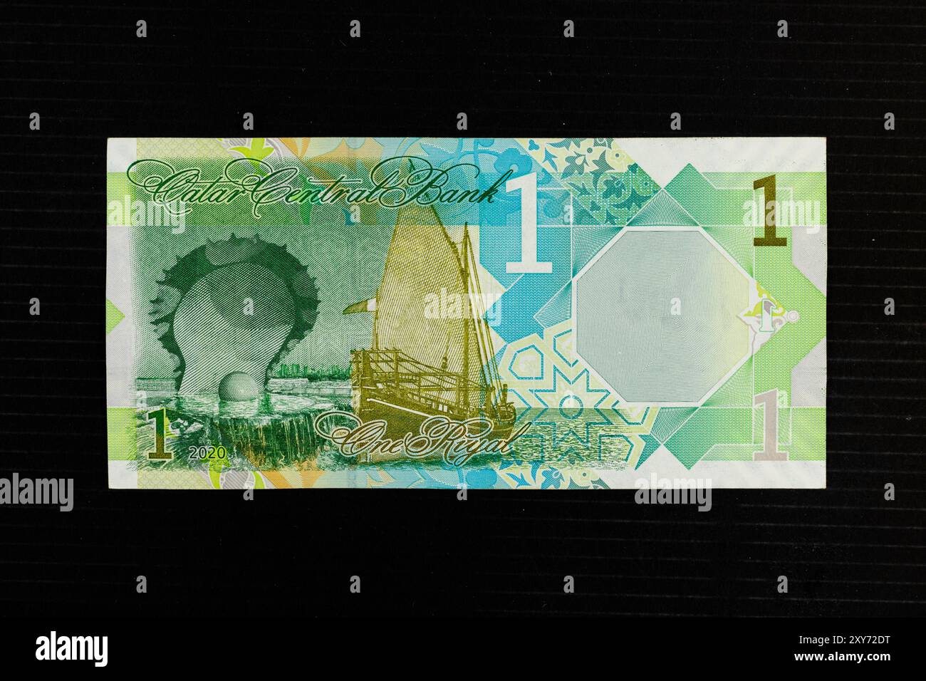 Traditional dhow (Bateel) and the oyster and pearl monument, portrait ...