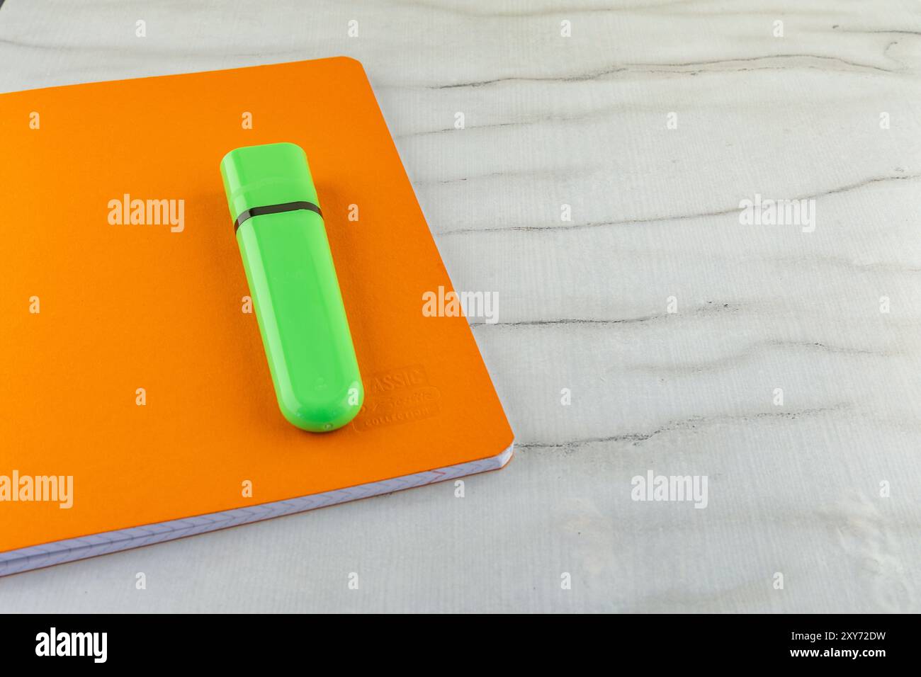 A green marker for marking text placed in the notebook preparing school ...