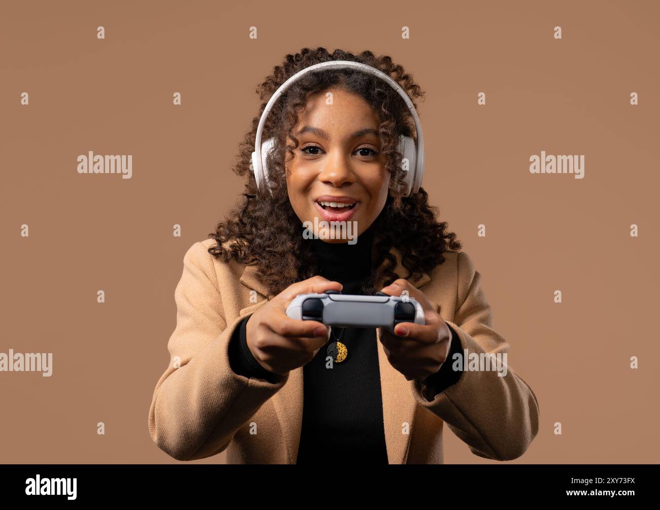 Pretty zoomer young african american woman playing video exciting game ...