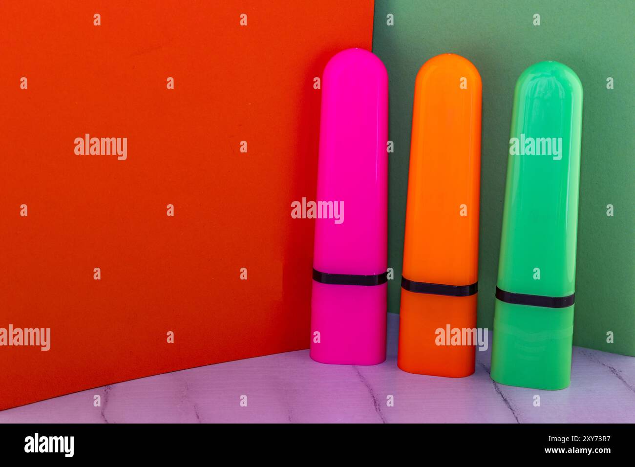 Colorful thick highlighters, markers, placed vertically on a desk in ...