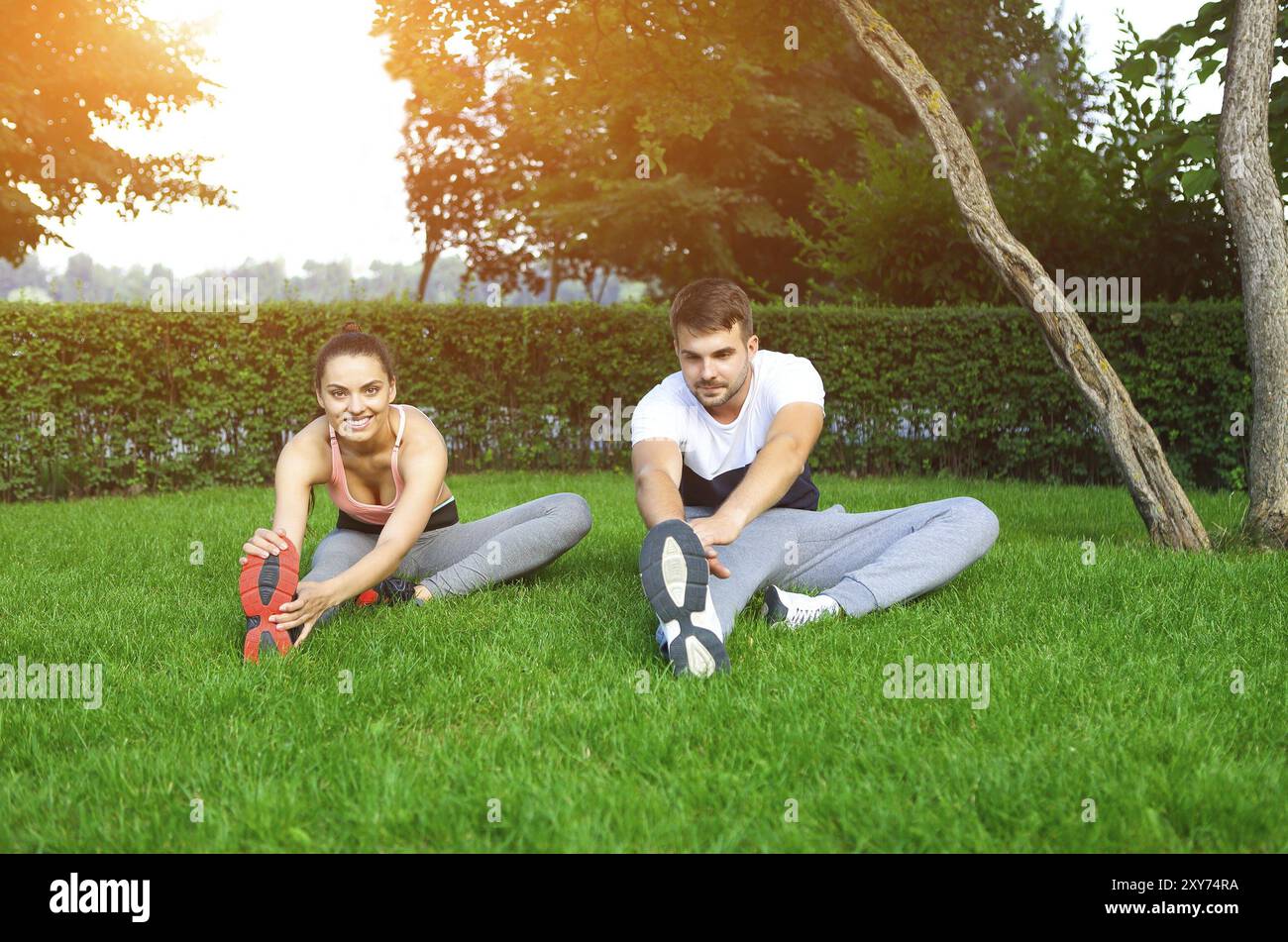 Young couple practice stretching together hi-res stock photography and images - Alamy