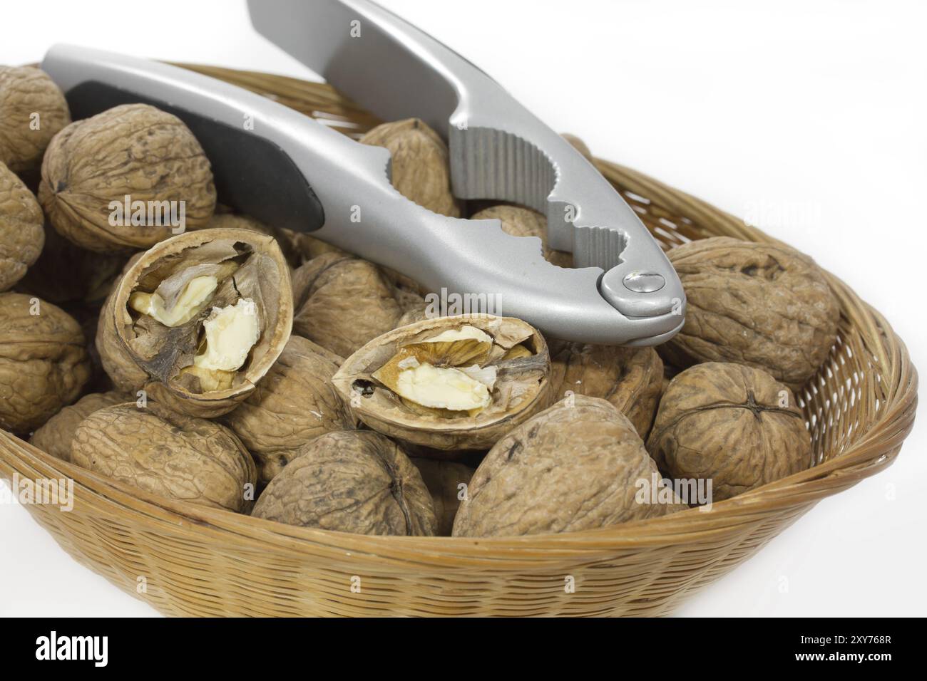 Walnuts nutcracker in basket hi-res stock photography and images - Alamy