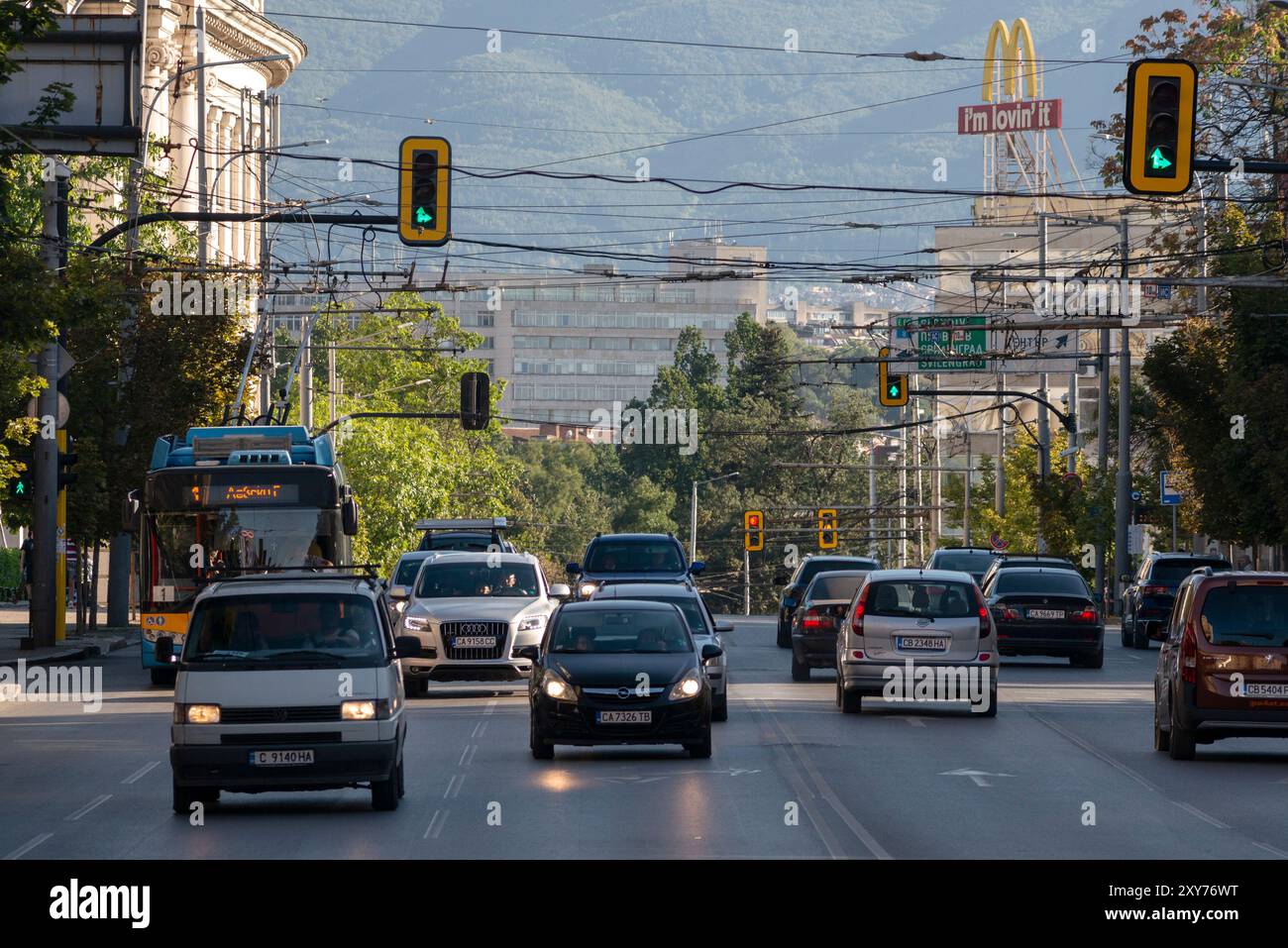 Sofia Bulgaria street view of car traffic during rush hour with light and shadows as vibrant ...