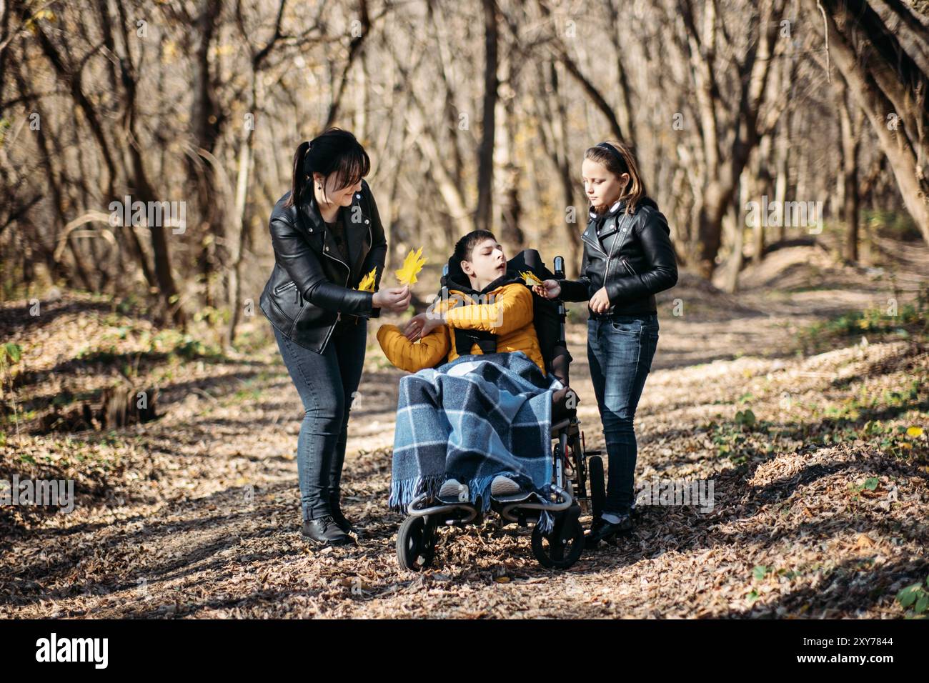 Mother and child with special needs on forest walk, nature therapy ...