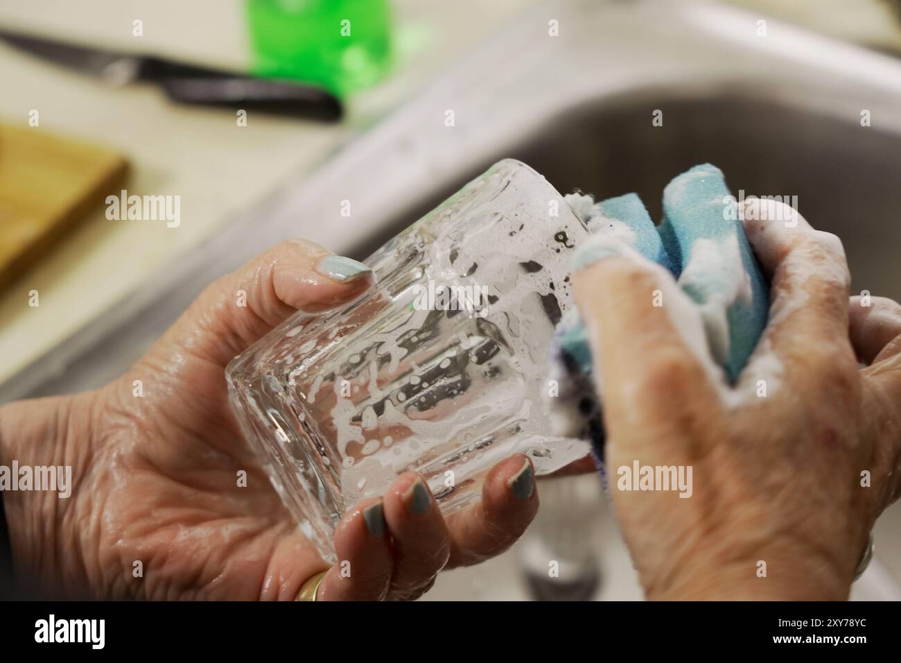 washing glass tumbler in dishwasher Stock Photo - Alamy