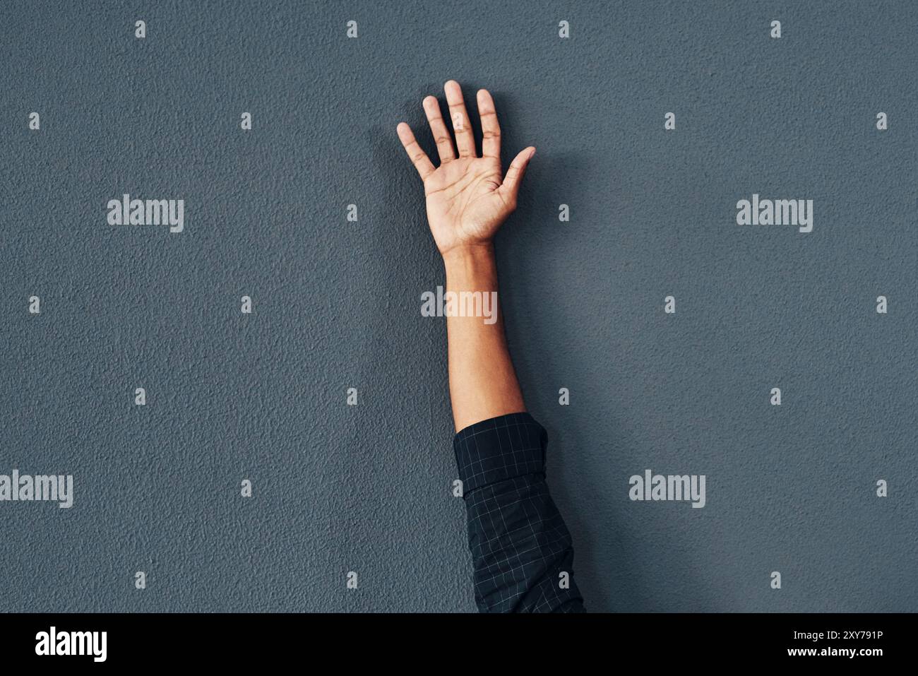 Wall background, reach and hand of person in studio raised for question ...