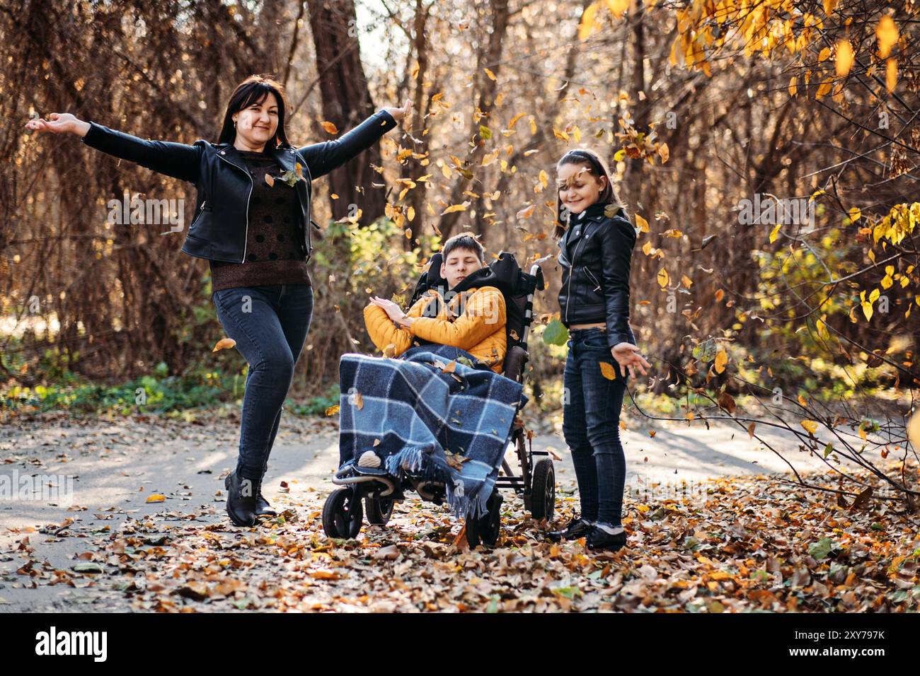 Mother and children in autumn, special needs care, emotional support ...