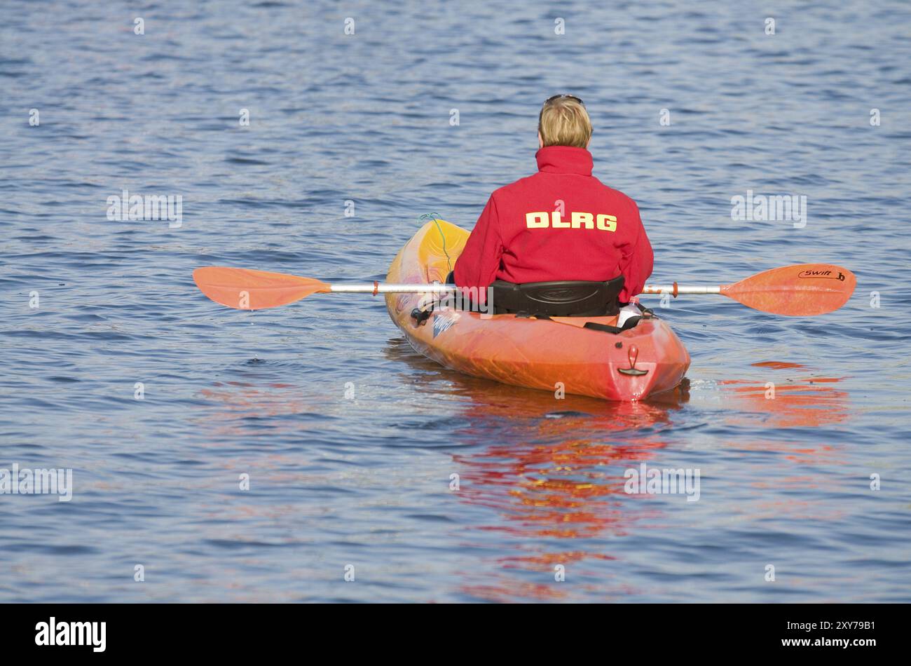 Kayak and lifeguard of the DLRG. Kayak and lifeguard Stock Photo - Alamy