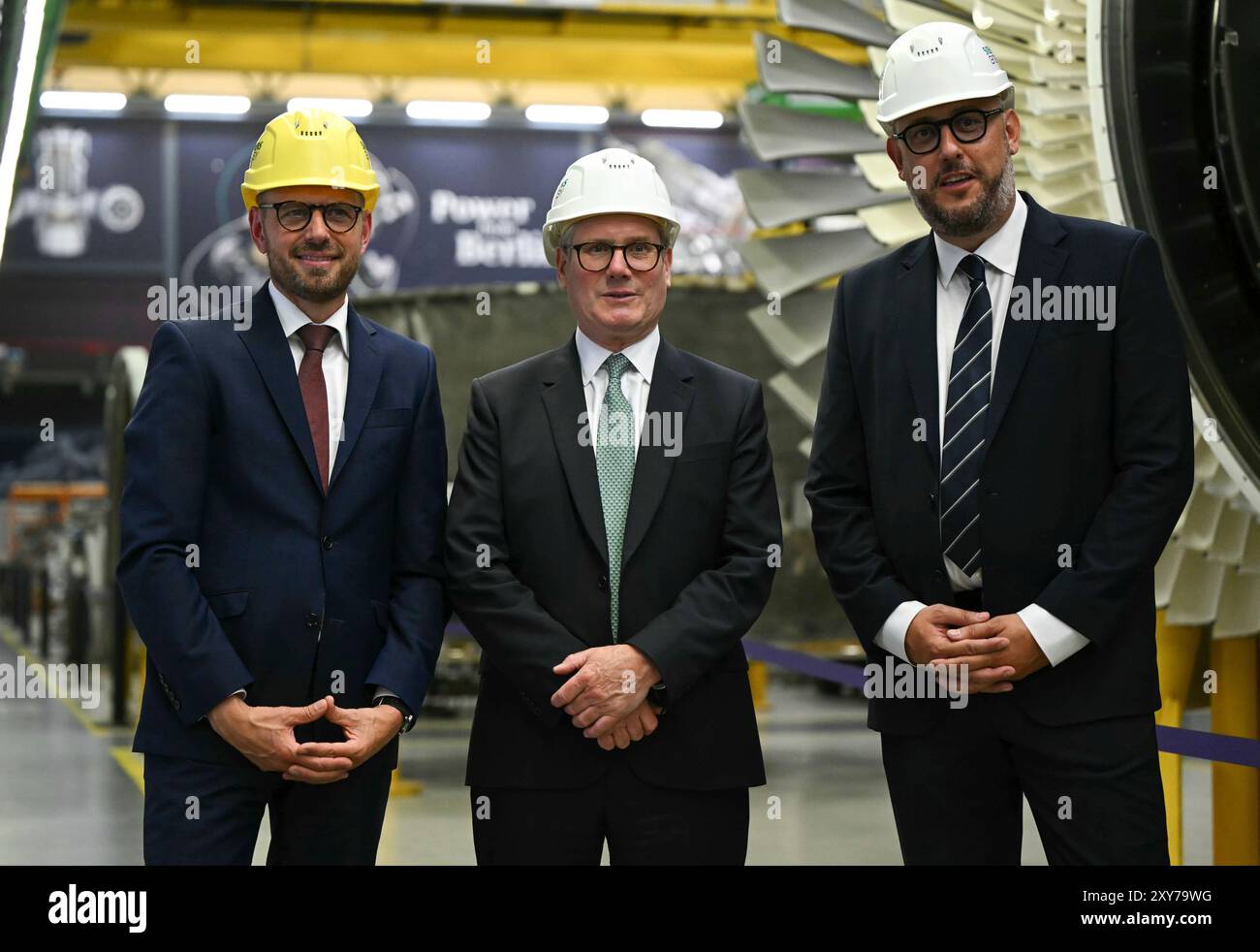 Britain's Prime Minister Keir, center, visits with CEO of Siemens ...