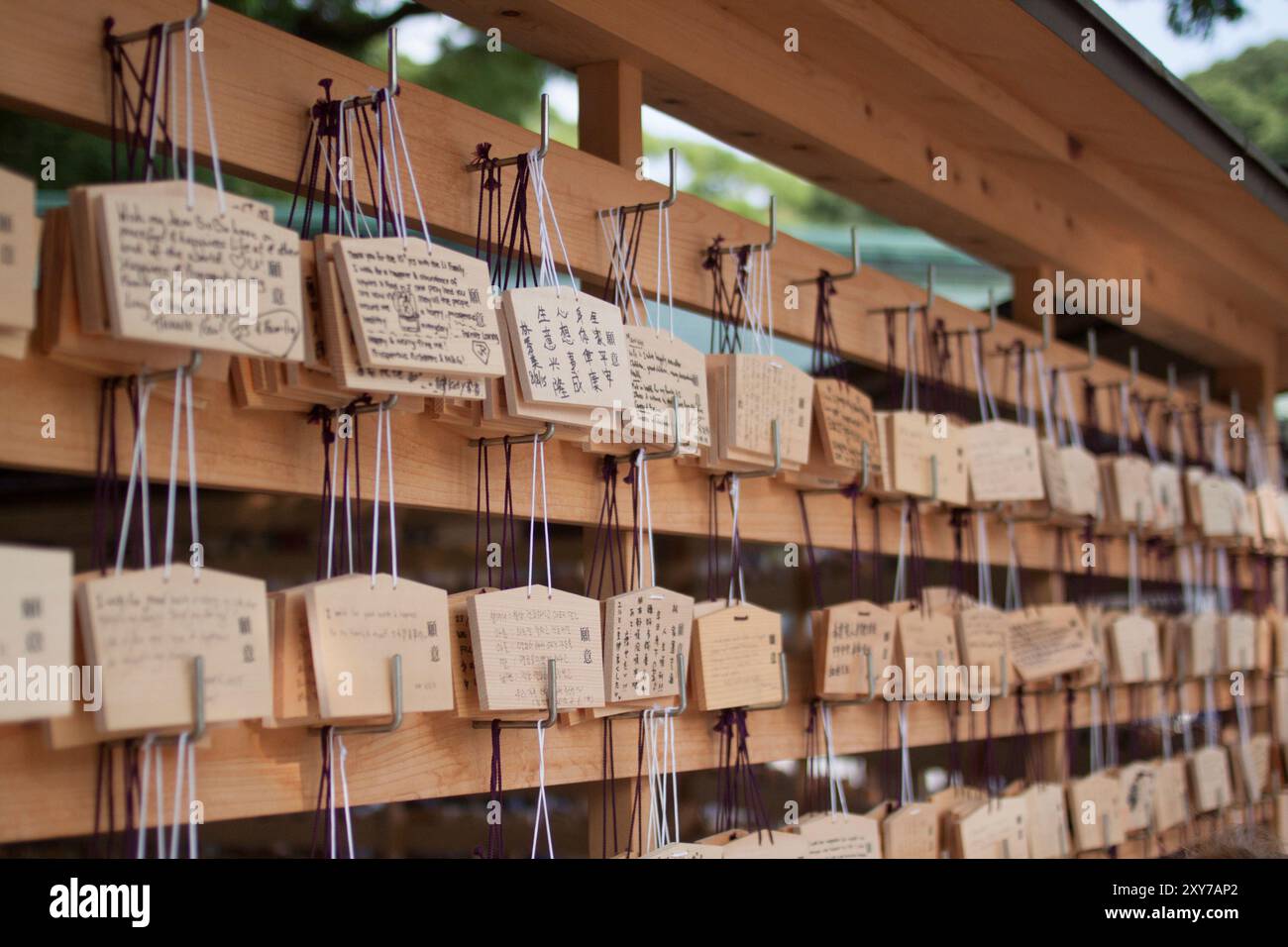 Hand writing of personal wishes and prayers on wooden boards called ema ...