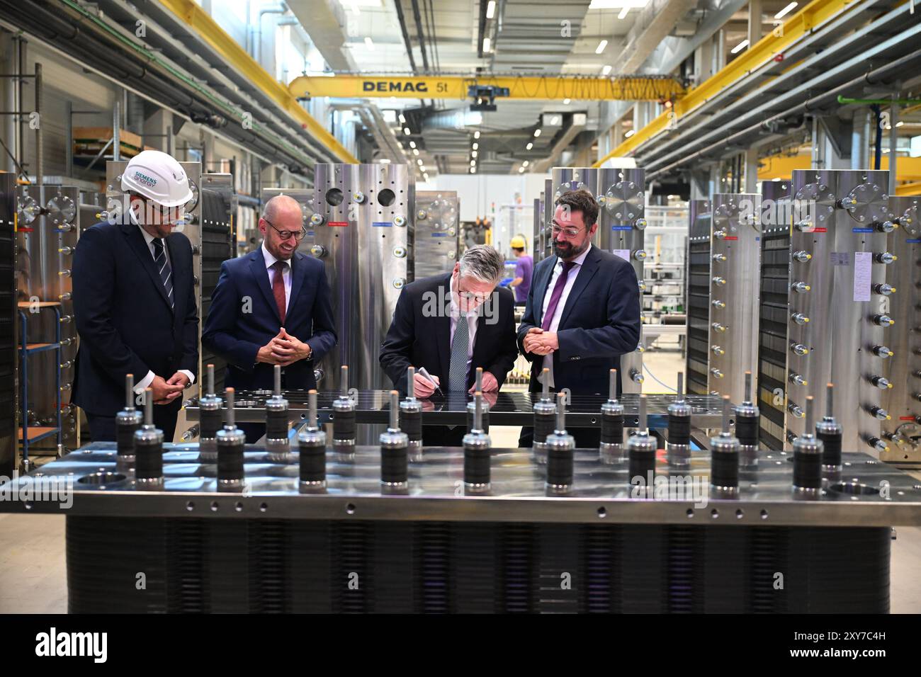 CEO of Siemens Energy Christian Bruch (second left) and Vice President Siemens Energy UK Darren ...