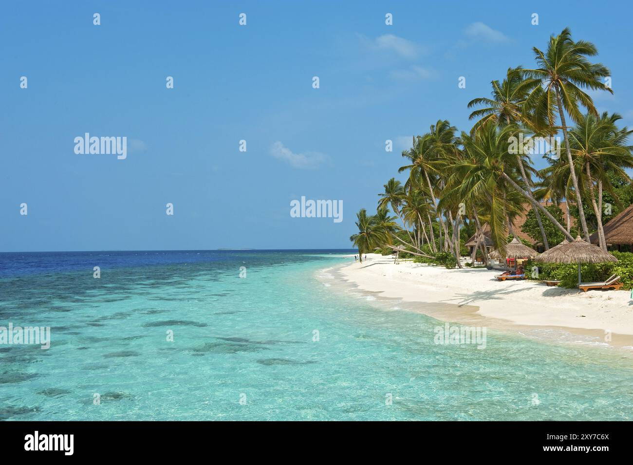 View of beach with turquoise blue water in shallow lagoon of Maldives ...