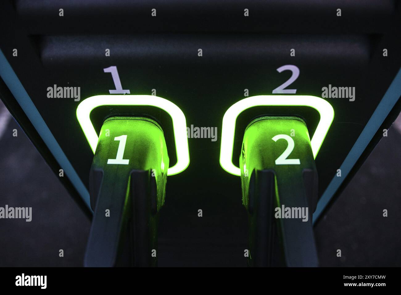 Two charging handles of an electric car charger Stock Photo - Alamy