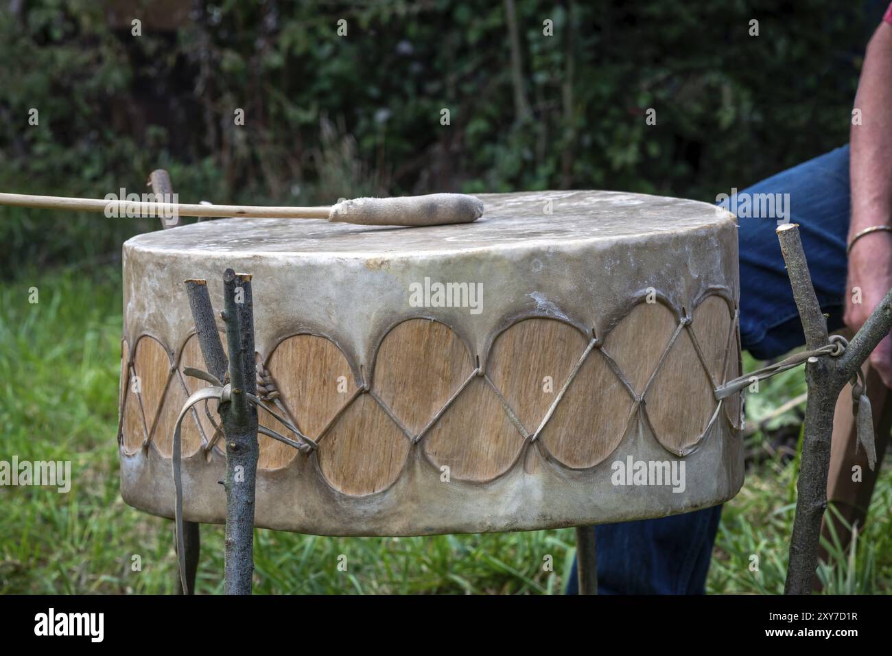 North American Indian drum made of rawhide with mallet ready to play in ...