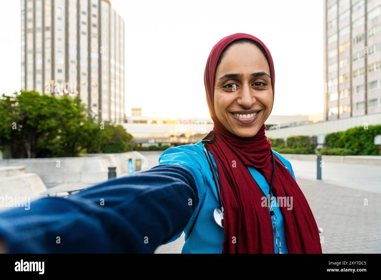 Beautiful arab nurse wearing hijab portrait at the city hospital ...