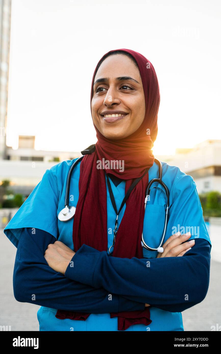 Beautiful arab nurse wearing hijab portrait at the city hospital ...