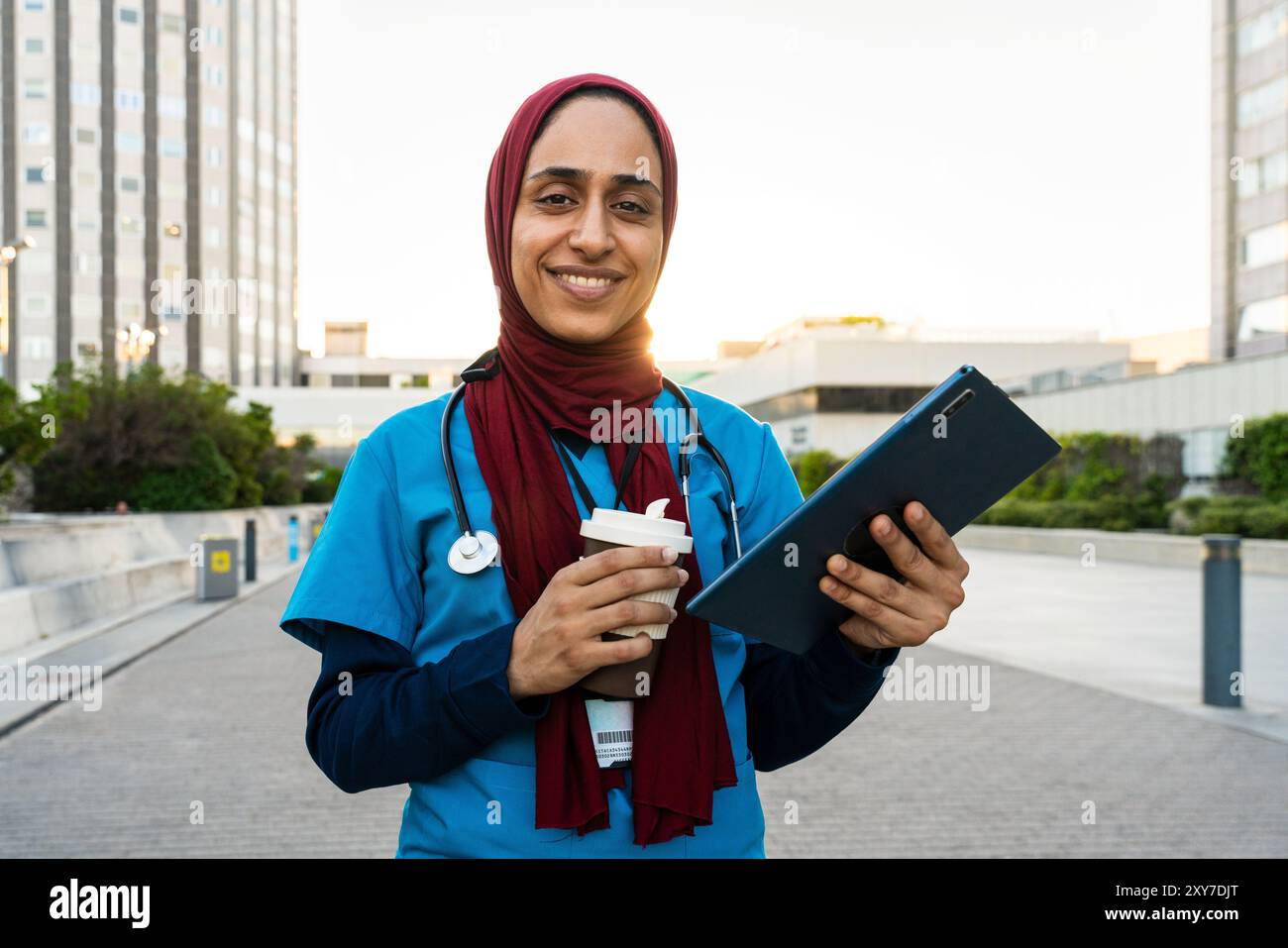 Beautiful arab nurse wearing hijab portrait at the city hospital ...
