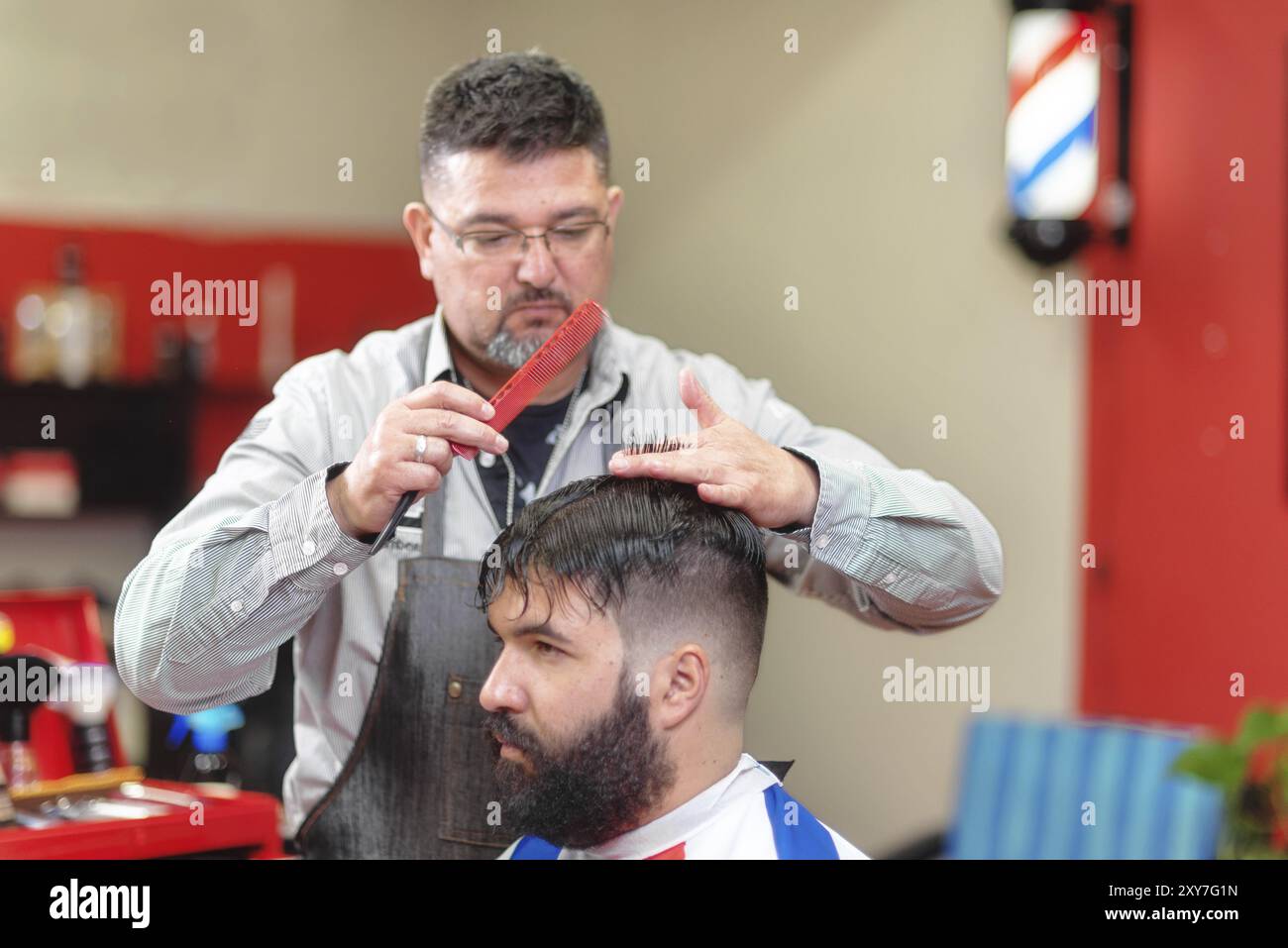 Handsome guy getting haircut hi-res stock photography and images - Alamy