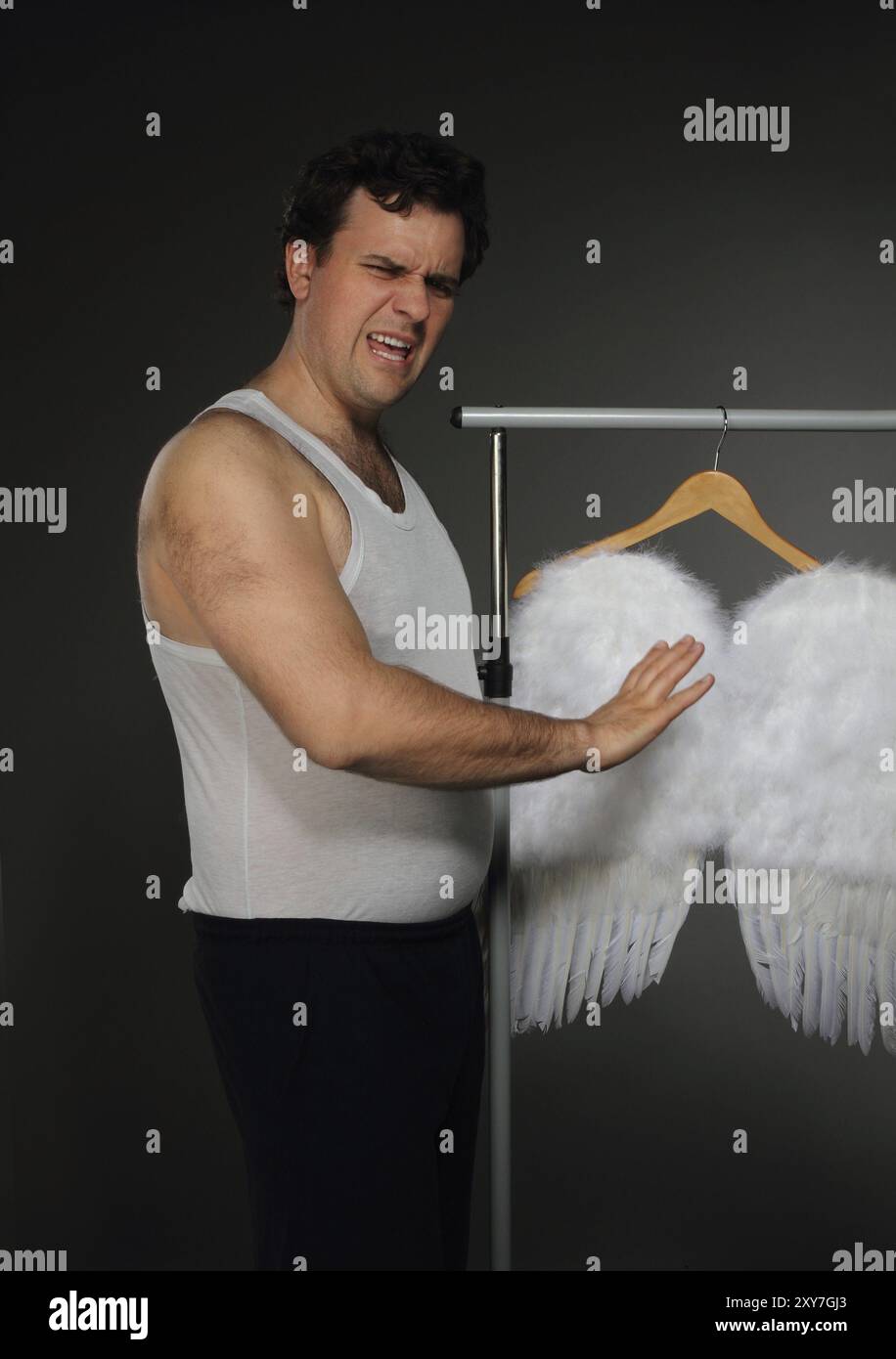 Mr. Angel with white wings. Creepy character portrait Stock Photo - Alamy