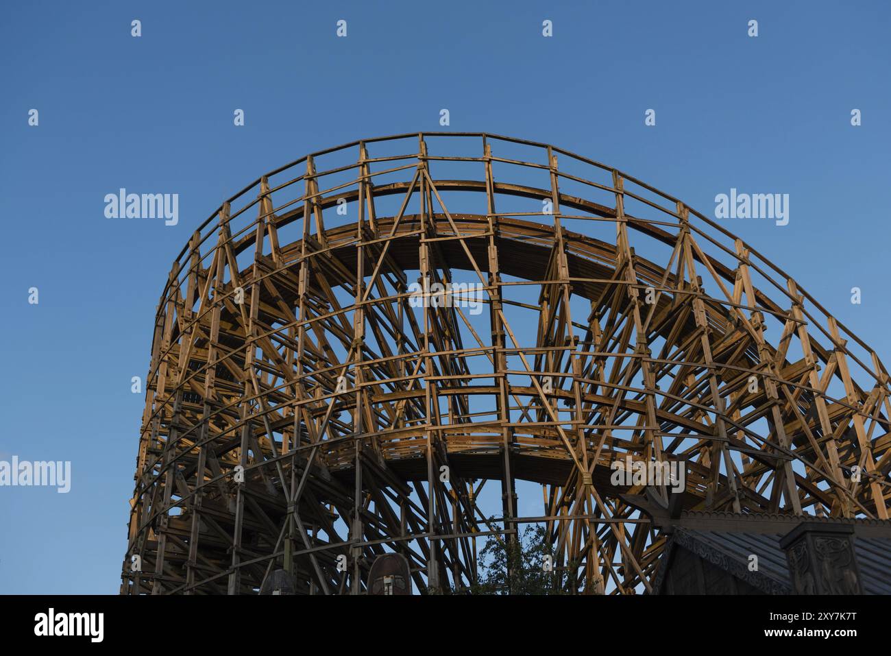 Curve of a large wooden roller coaster Stock Photo - Alamy